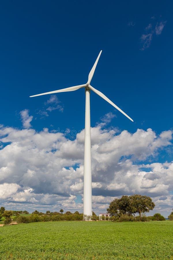 Wind Turbine Against Sun and Windmill Farm Stock Image - Image of ...