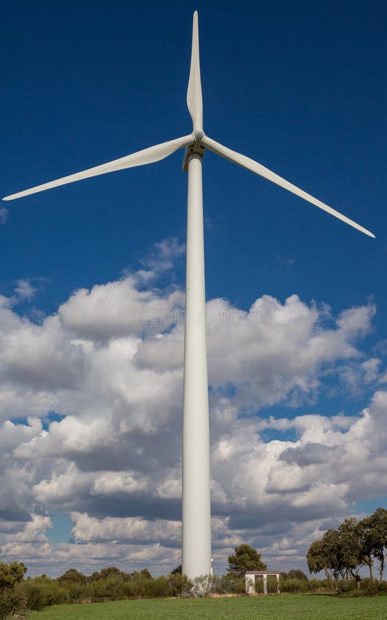 Wind Turbine Against Sun and Windmill Farm Stock Image - Image of ...