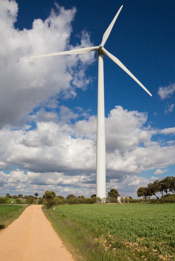 Wind Turbine Against Sun and Windmill Farm Stock Image - Image of ...
