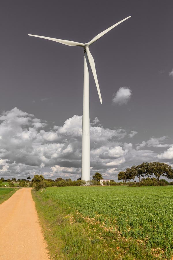 Wind Turbine Against Sun and Windmill Farm Stock Image - Image of ...