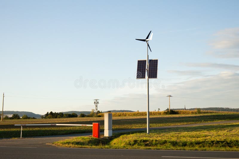 Wind Turbine with Solar Panel Stock Photo - Image of wind, barrier ...