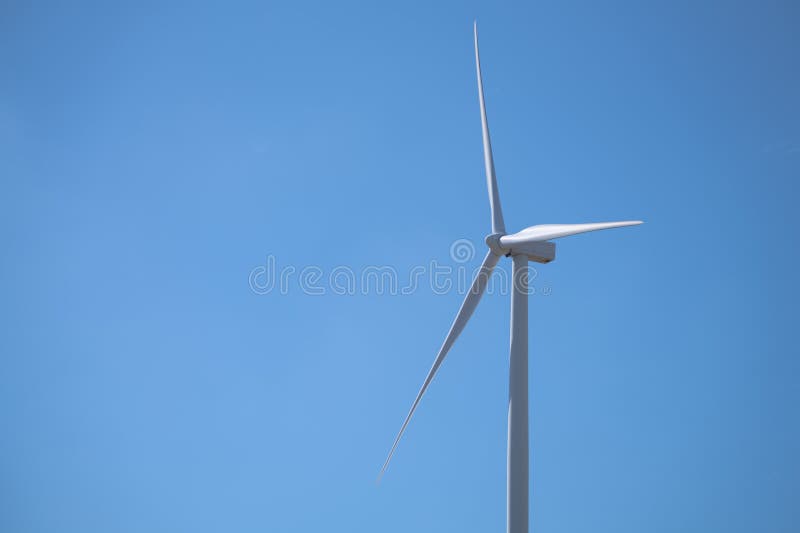 Wind Turbine is Standing Tall in Blue Sky, Wind Energy. Wind Power ... Wind Turbine is Standing Tall in Blue Sky, Wind Energy. Wind Power ...