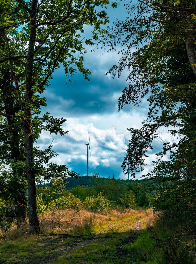 A Wind Turbine Stands in the Forest on a Mountain in Germany Stock ...
