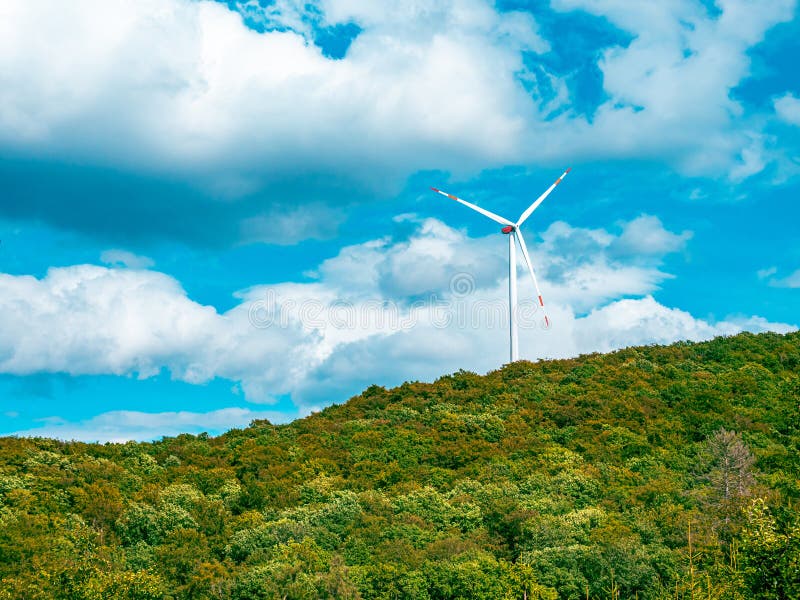 A Wind Turbine Stands in the Forest on a Mountain in Germany Stock ...