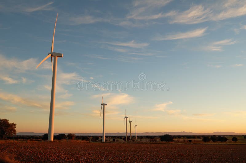 Wind turbine at sunset stock photo. Image of environmental - 22374582