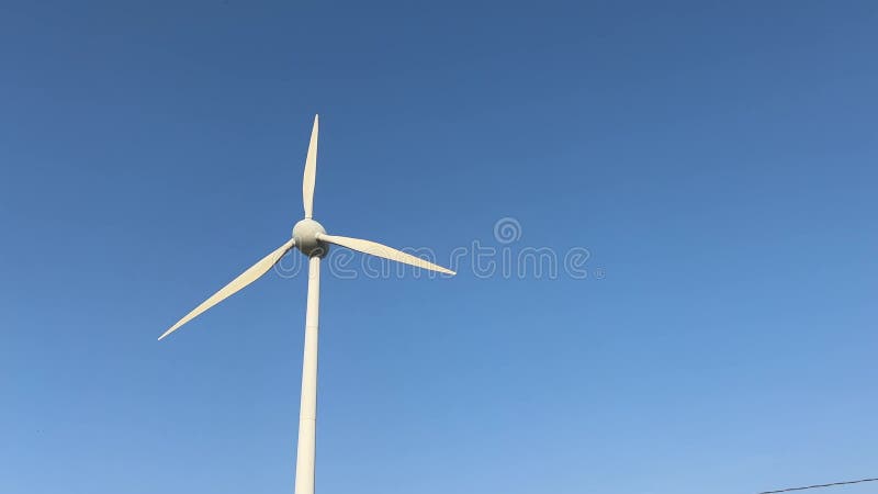 Wind Turbine Working Against Blue Sky in Bright Sunlight Stock Video ...
