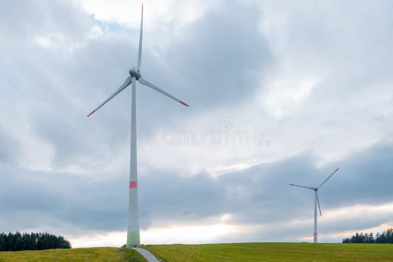 Wind Turbines Against Grey Sky Generation Green Energy Stock Photos ...