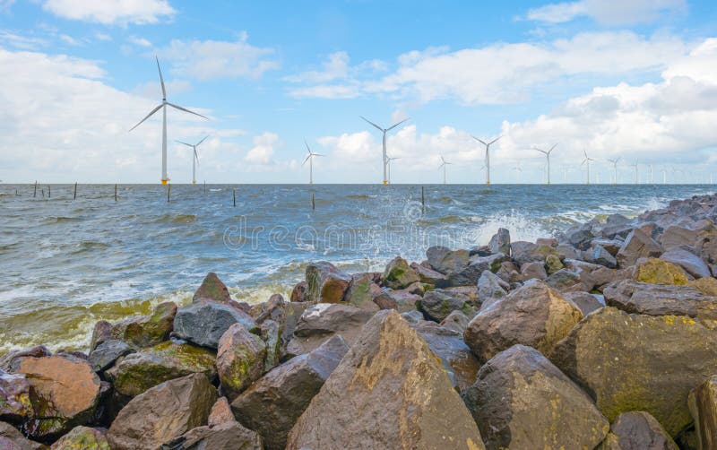 Wind Turbines Along a in Spring Stock Photo - Image of wind, coast ...