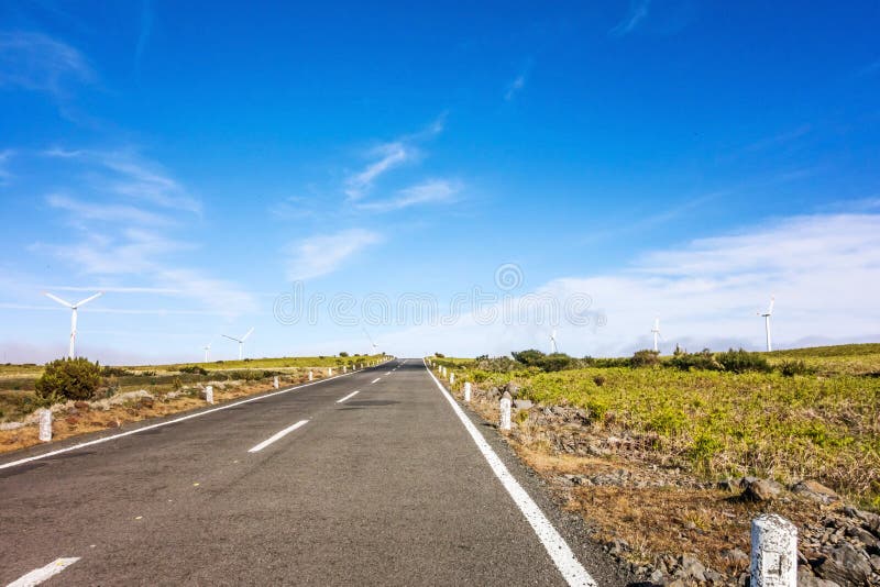 Wind Turbines Along Road - Blue Sky Stock Image - Image of hill, nature ...