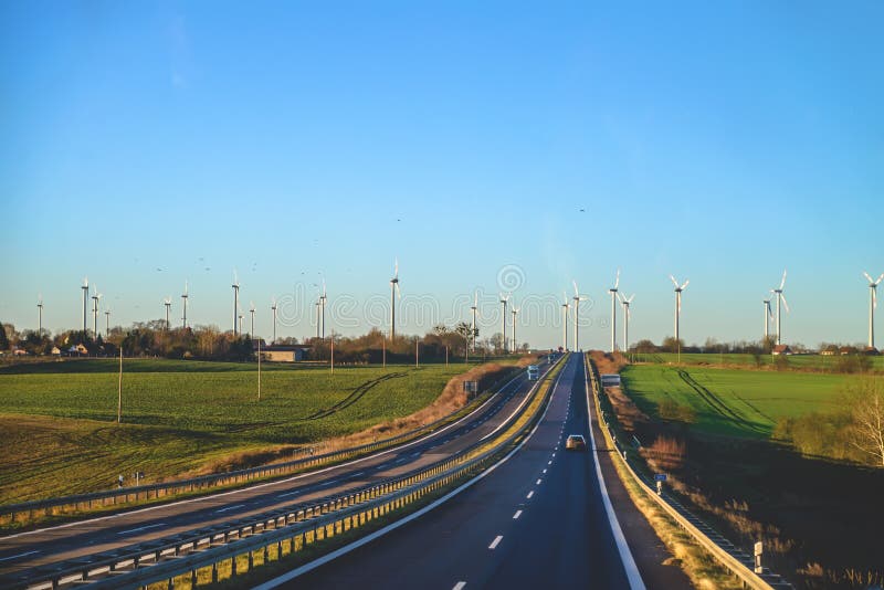 Wind Turbines Along the Roadway Stock Photo - Image of field ...