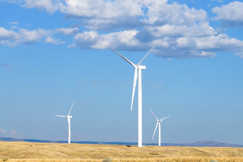 Wind Turbines on an Arid Hillside with Blue Sky in Washington State ...