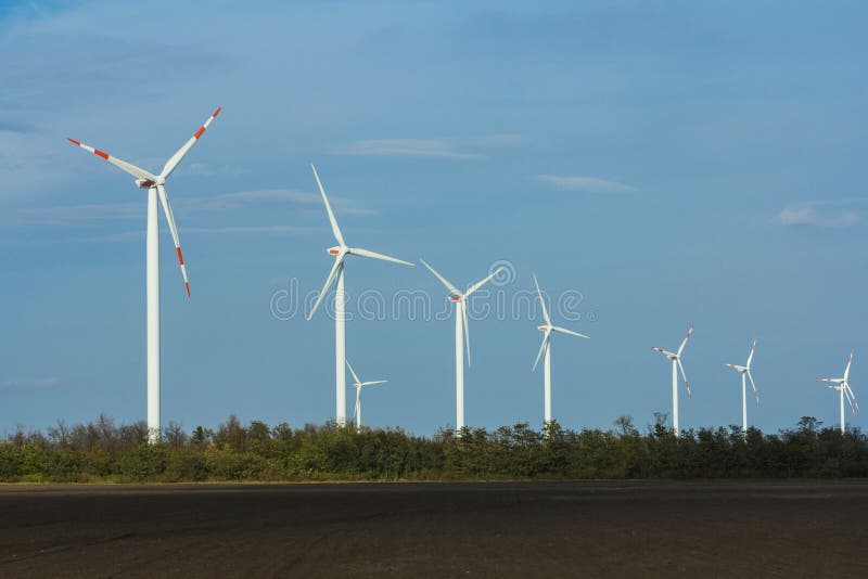 Wind turbines allined stock image. Image of technology - 262115847
