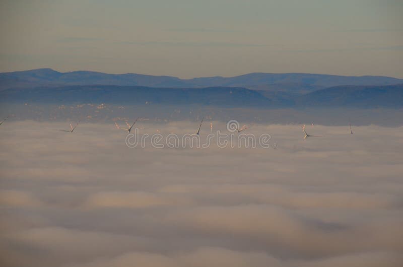 Wind turbines in fog stock image. Image of clouds, landscape - 65307095