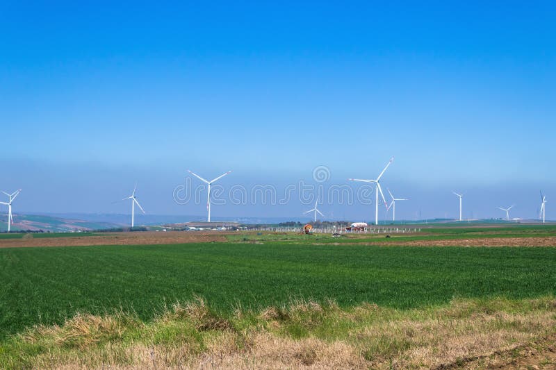 Wind Turbines Generating Energy from the Wind, in Nature, Clear Blue ...
