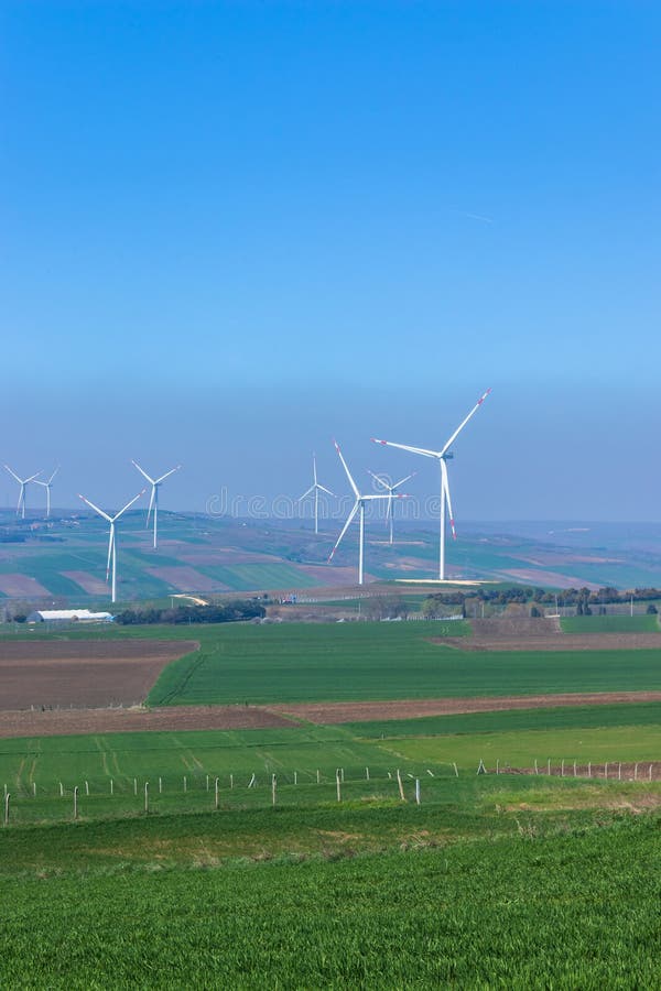 Wind Turbines Generating Energy from the Wind, in Nature, Clear Blue ...
