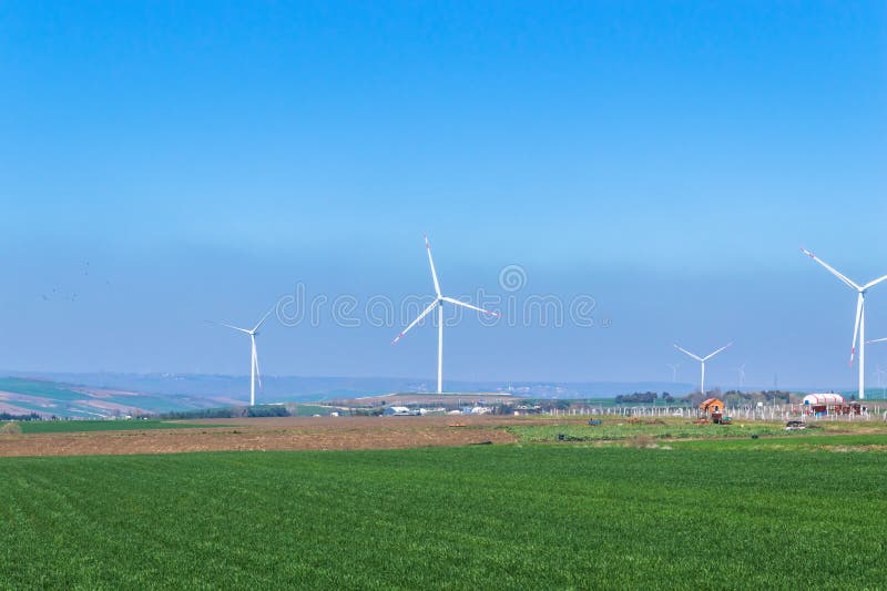 Wind Turbines Generating Energy from the Wind, in Nature, Clear Blue ...