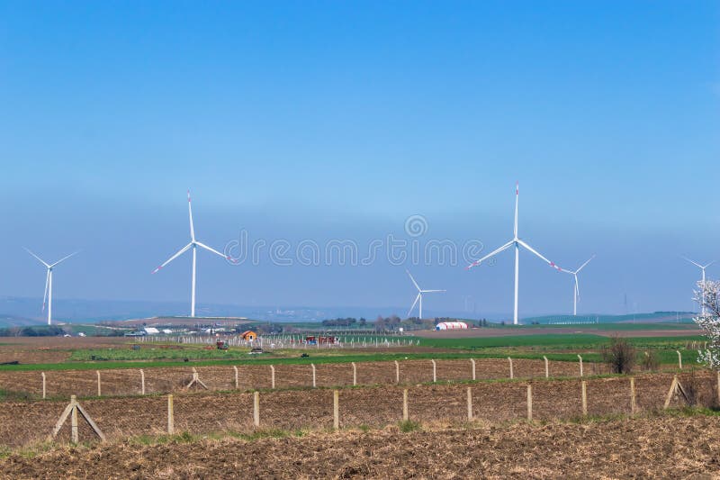 Wind Turbines Generating Energy from the Wind, in Nature, Clear Blue ...
