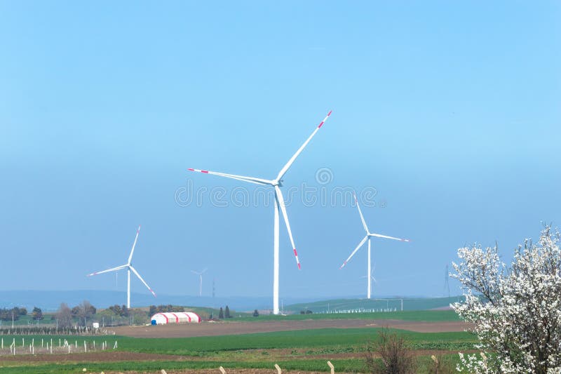 Wind Turbines Generating Energy from the Wind, in Nature, Clear Blue ...