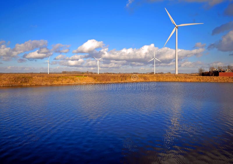 Wind Turbines and lake stock photo. Image of ecological - 4161508