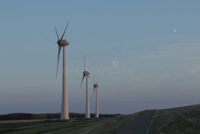 Wind Turbines in a Landscape after Sunset Stock Photo - Image of rotor ...