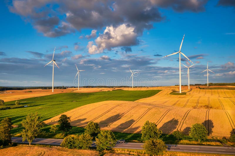 Wind Turbines on the Meadow Over the Blue Sky Stock Photo - Image of ...