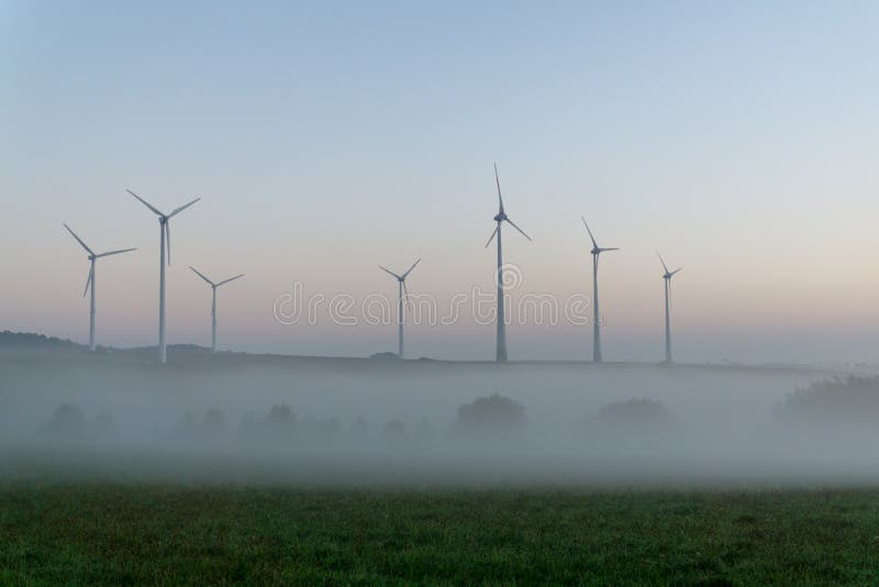 Wind Turbines in the Morning, Partially Covered by Mist Stock Image ...
