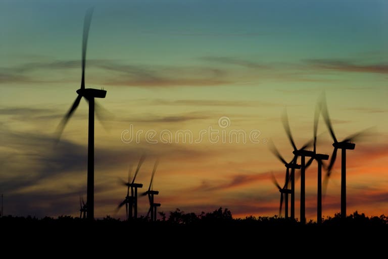Wind Turbines in Motion at Dusk Stock Photo - Image of modern, creating ...