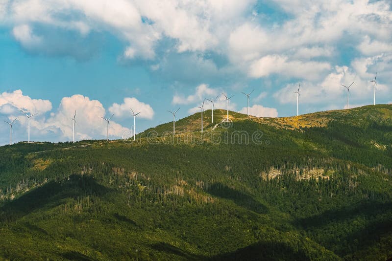 Wind turbines on mountain stock photo. Image of mill - 255462316
