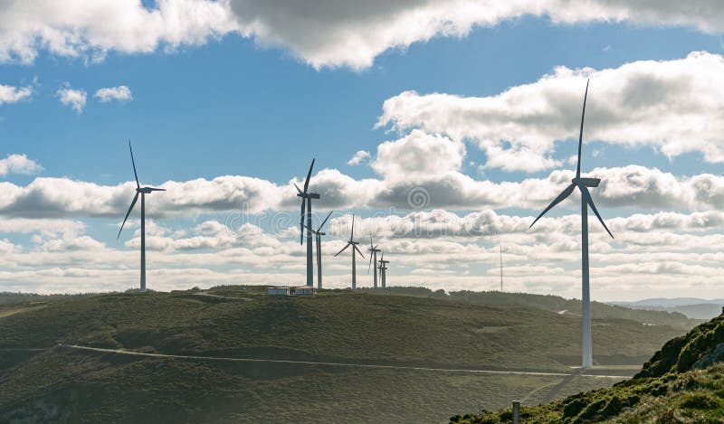 Wind turbines in mountains stock photo. Image of countryside - 237950882