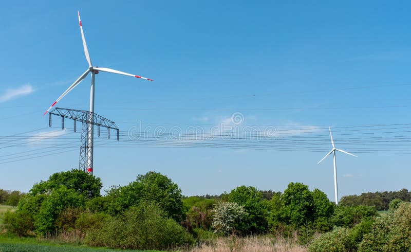 Wind Turbines, Overhead Lines and Scrub Stock Photo - Image of overhead ...