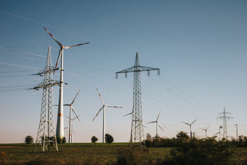 Wind Turbines and Power Lines on a Field Stock Image - Image of ...