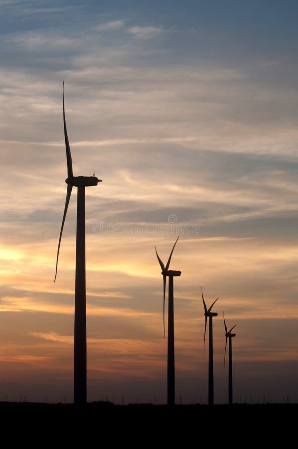 Wind turbines at sunset stock photo. Image of sunset - 16654896