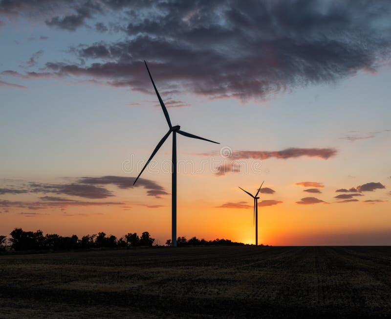 Wind turbines at sunset stock image. Image of blue, energy - 193707259