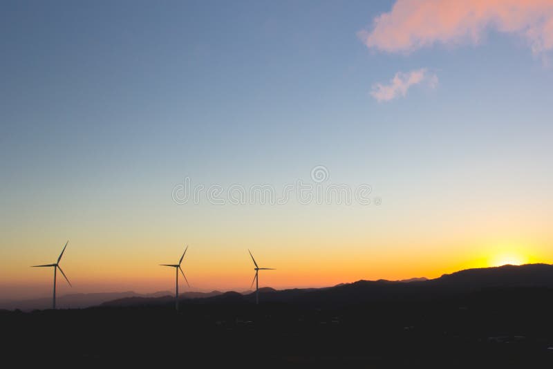 Wind turbines in sunset stock image. Image of generation - 132532601