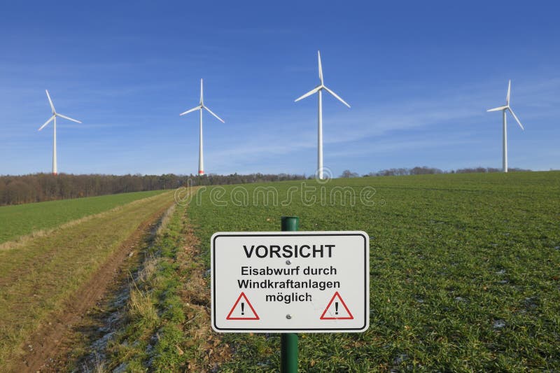 Wind Turbines and Warning Sign Stock Photo - Image of mill, mast: 22948240