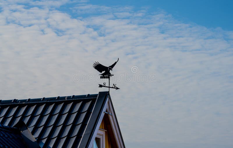 Wind Vane Shaped As a Soaring Eagle on Top of a Roof.. Stock Photo ...