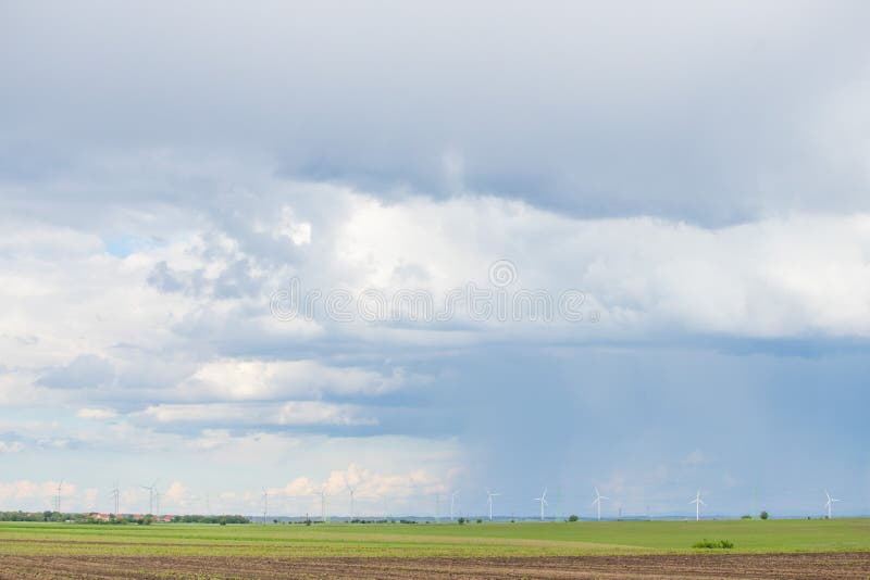 Wind Warm on Snowy Agricultural Ground with Cloudy Sky in Background ...