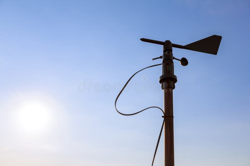 Wind Wheel and Anemometer on the Background of Clear Blue Sky. Stock ...