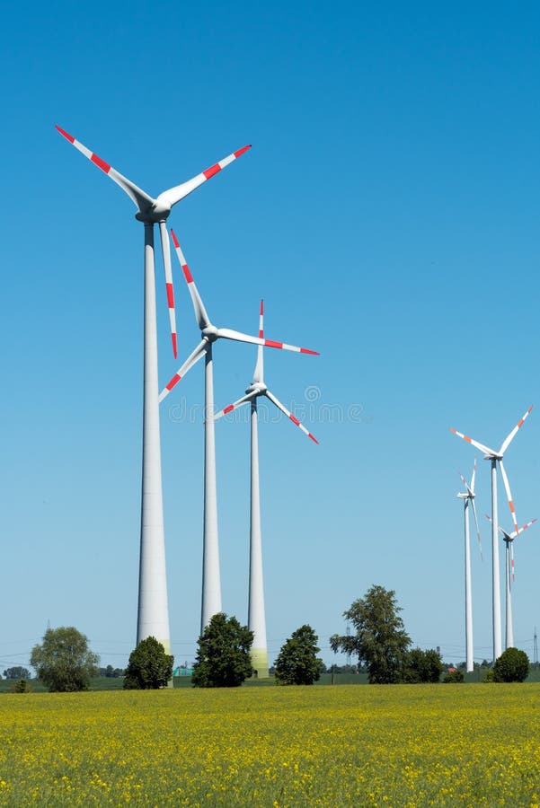 Wind Wheels And Overhead Power Lines Stock Photo - Image of cornfield ...