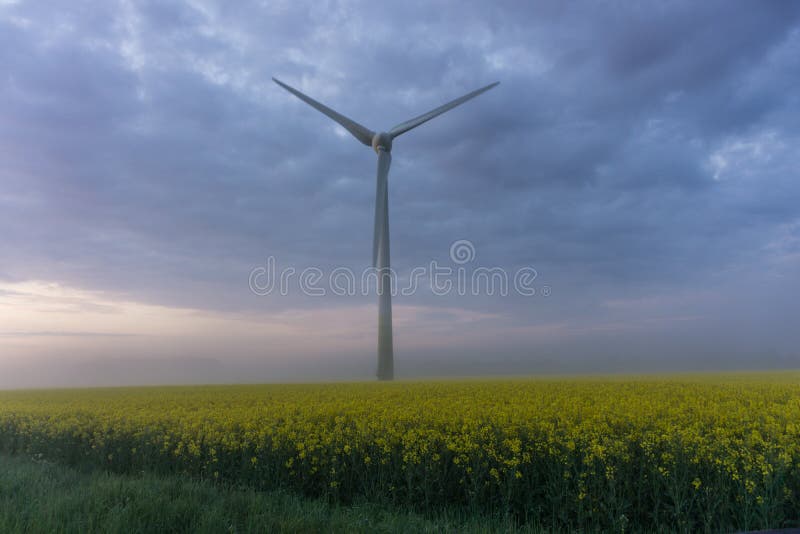 Wind Wheels at Sunrise and Fog Stock Photo - Image of northern, wind ...