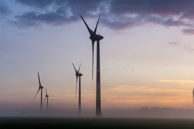 Wind Wheels at Sunrise and Fog Stock Photo - Image of nature ...