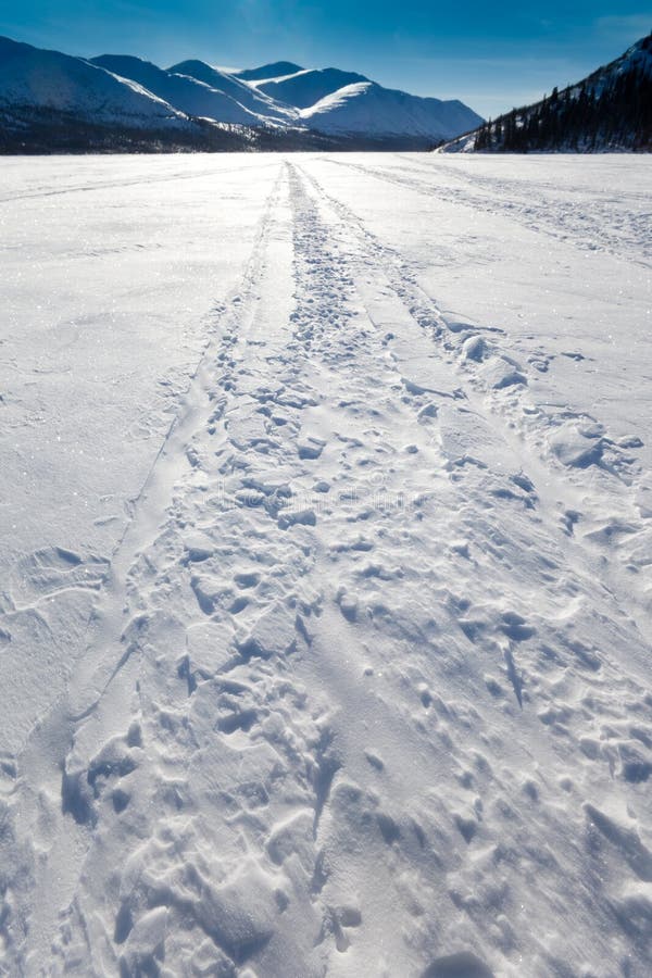 Windblown Snowmobile Tracks Stock Image - Image of freeride, frozen ...