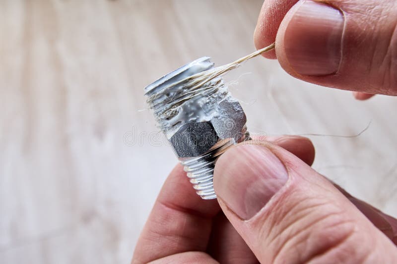 Winding Flax on Pipe Thread and Leak Seal with Mounting Plumbing Paste ...