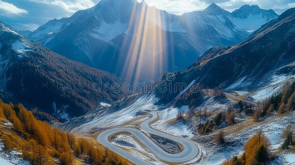 A Winding Mountain Road in the Middle of a Snowy Mountain Range Stock ...