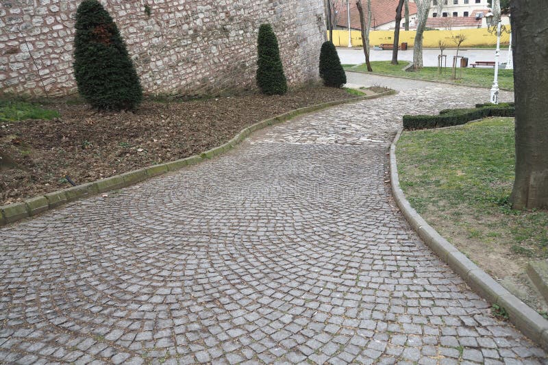 Curved Cobblestone Pathway in Quiet Urban Park Stock Photo - Image of ...