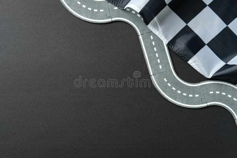 Winding Puzzle Road with Dashed Lines and Checkered Flag on Dark ...