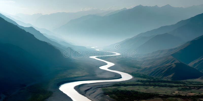 Winding River Flowing through Misty Mountain Valley with Soft Blue ...