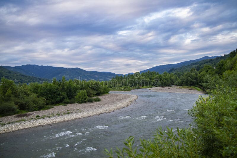 Winding River in the Mountains at Sunset Stock Photo - Image of green ...