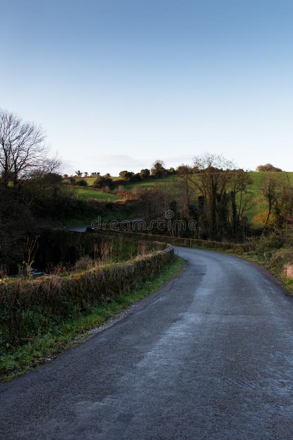 Winding Road in Irish Countryside Stock Photo - Image of cloudy, green ...