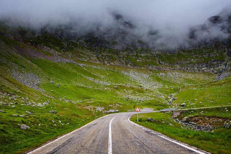 Winding road in mountains stock image. Image of route - 41957219